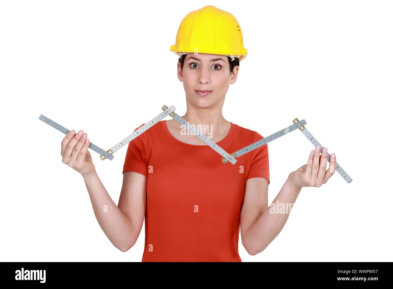 craftswoman holding a meter ruler Stock Photo - Alamy