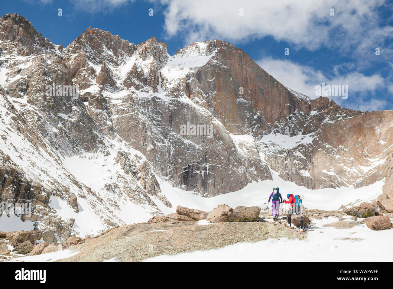 Climbers hike towards Chasm Lake and Longs Peak, Rocky Mountain ...
