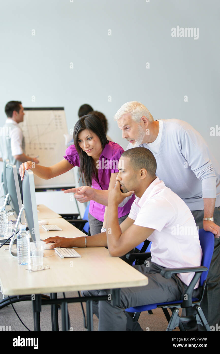 Business team at a computer Stock Photo - Alamy