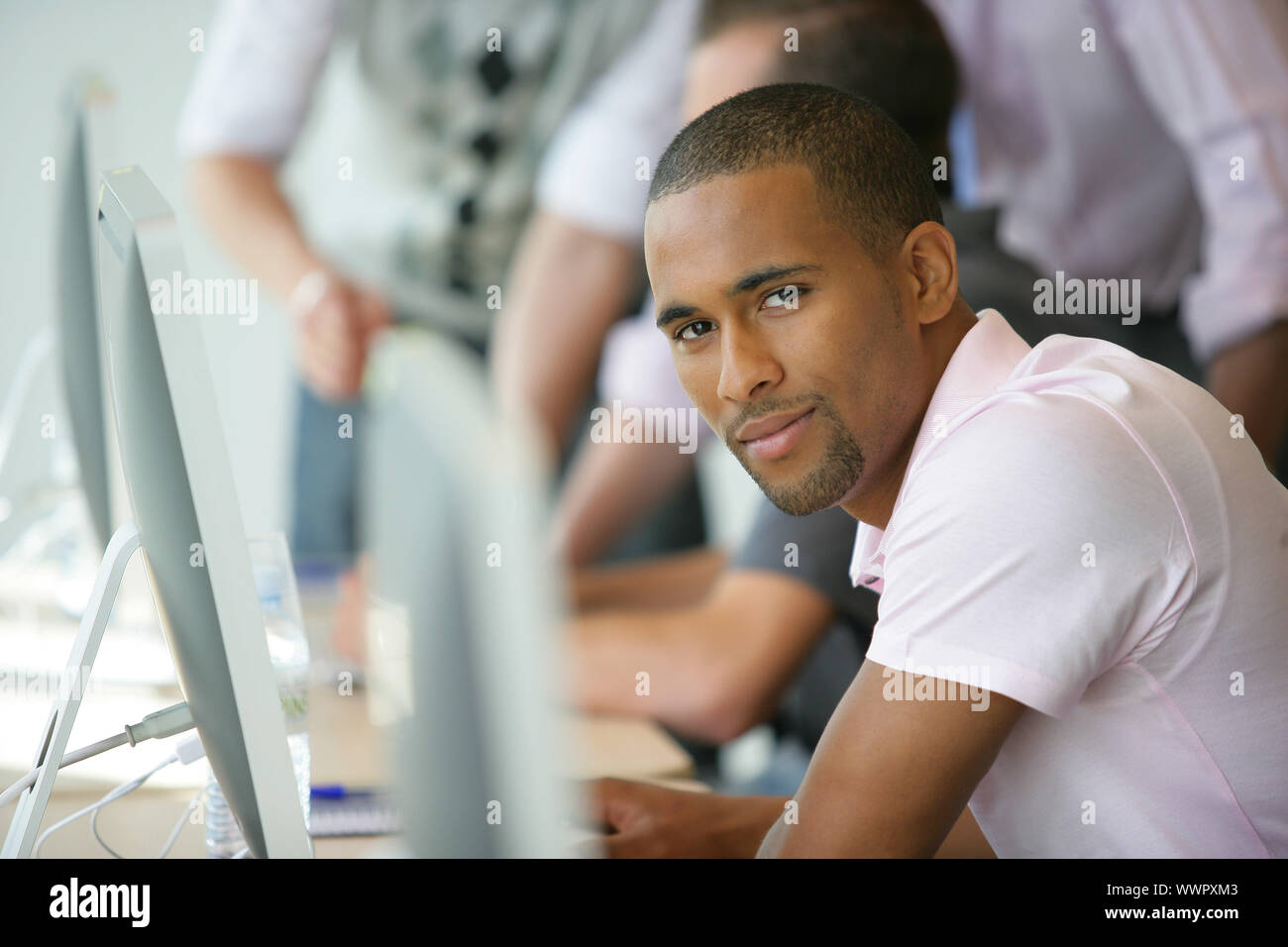 Casual office workers sat in a row Stock Photo - Alamy