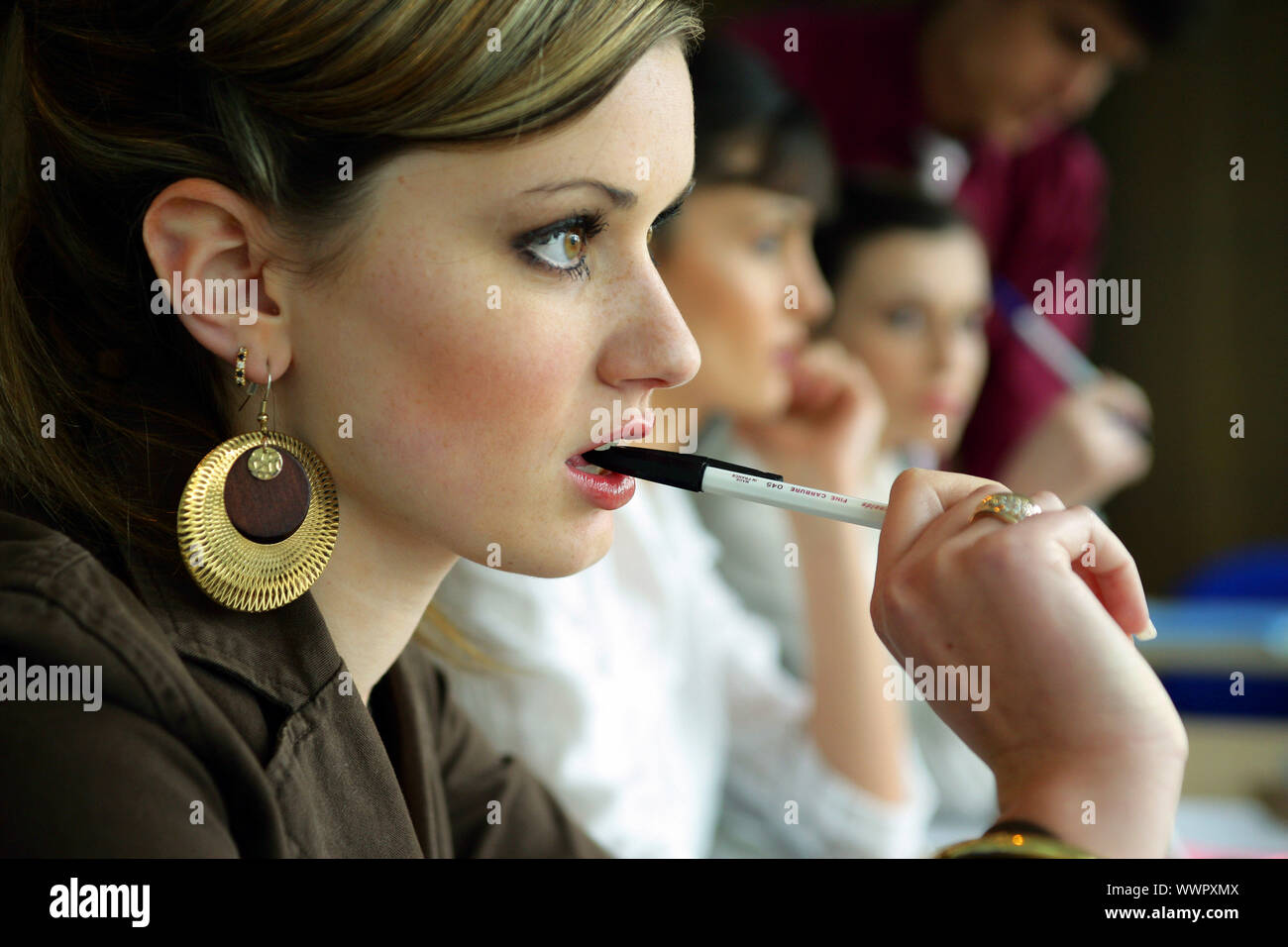 Young woman in class Stock Photo - Alamy
