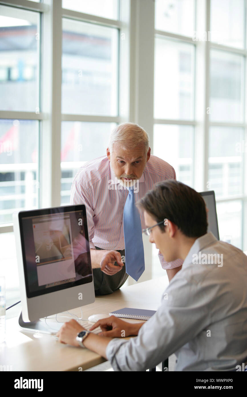Boss warning an employee Stock Photo - Alamy