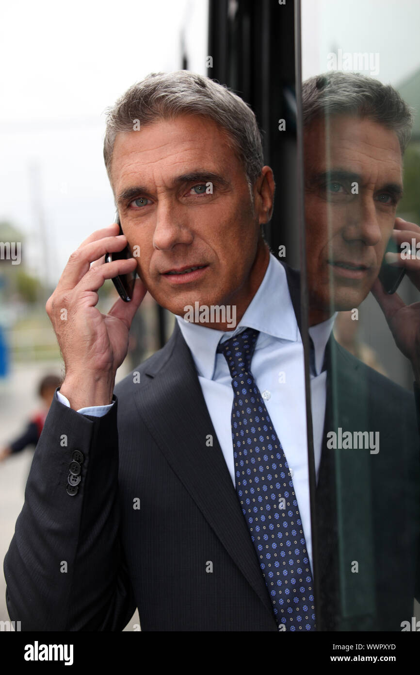 Smart man using a mobile phone Stock Photo - Alamy