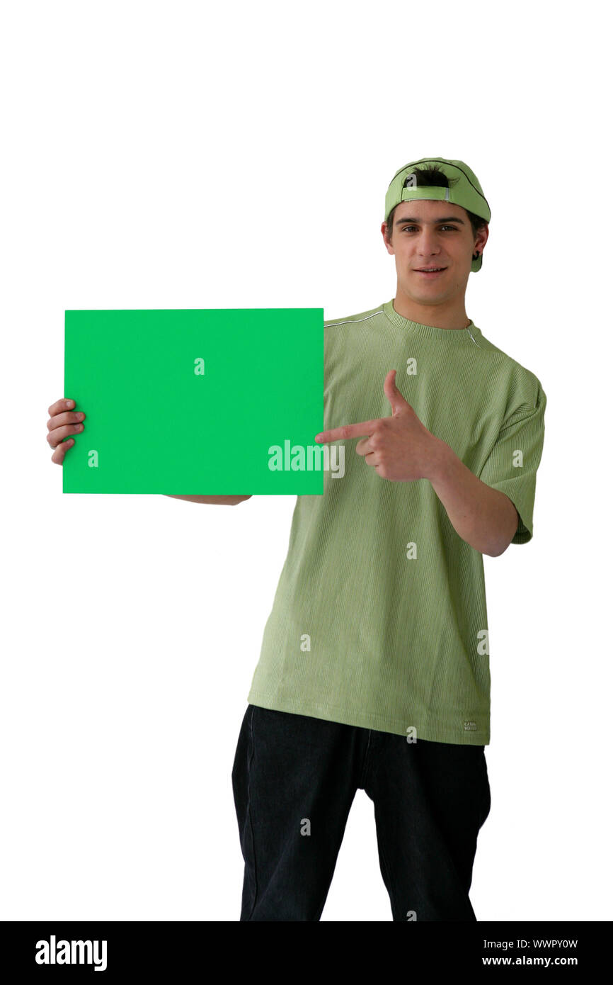 Young man holding up a green sign Stock Photo - Alamy