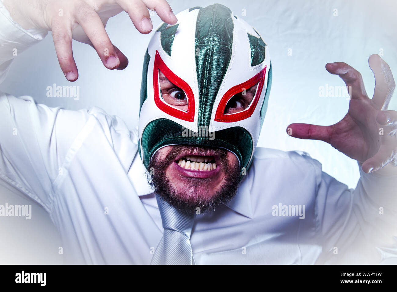 Bad, angry businessman with Mexican wrestler mask, expressions of anger ...