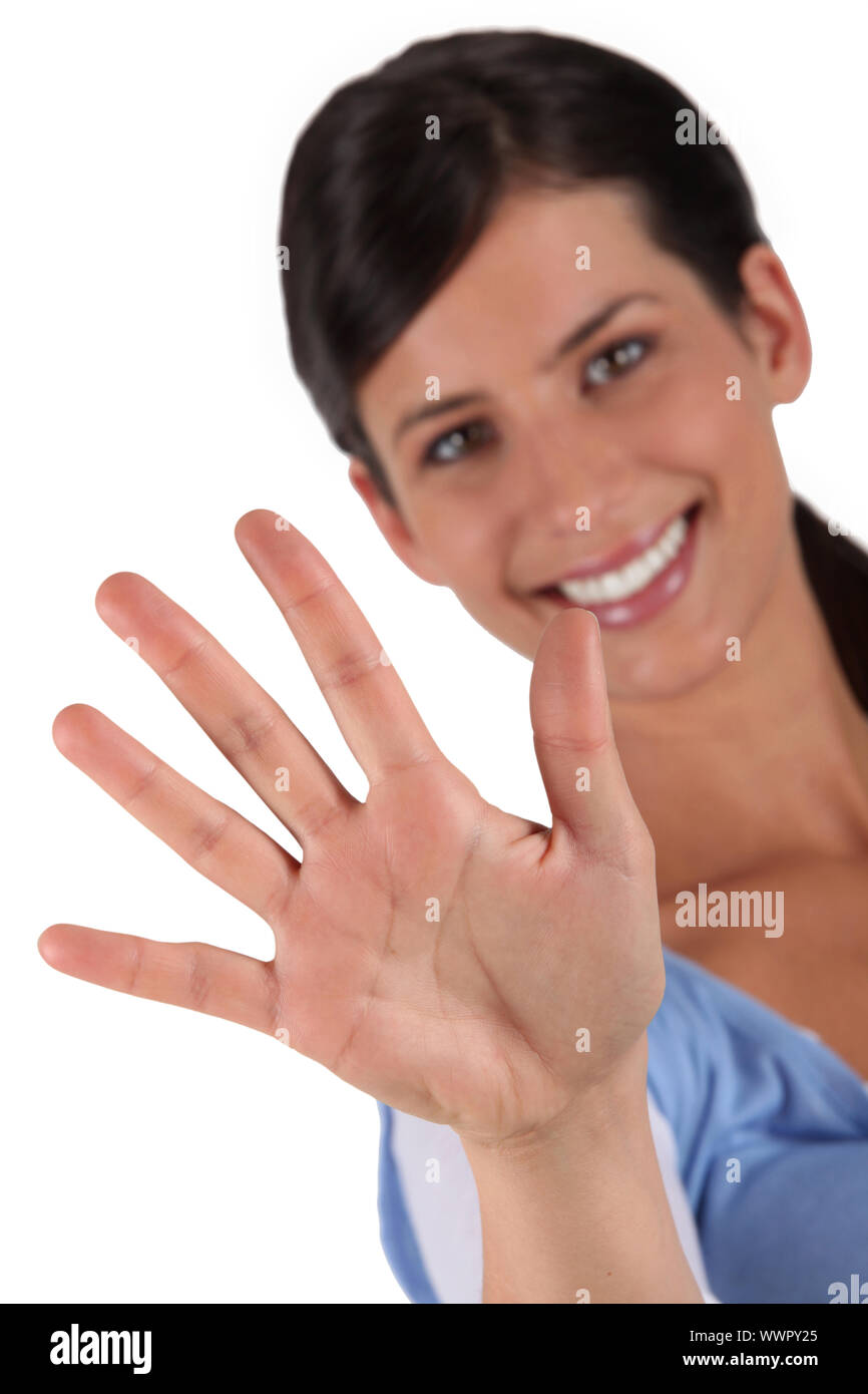 Woman holding up her hand Stock Photo - Alamy
