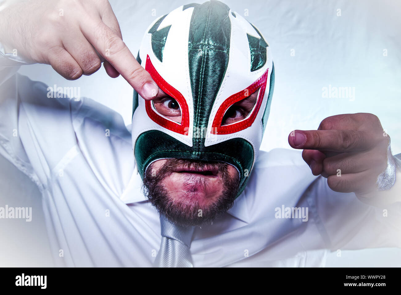Shocked, angry businessman with Mexican wrestler mask, expressions of ...