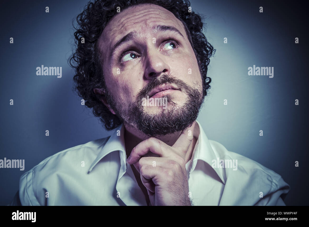 concern for the future, man with intense expression, white shirt Stock ...
