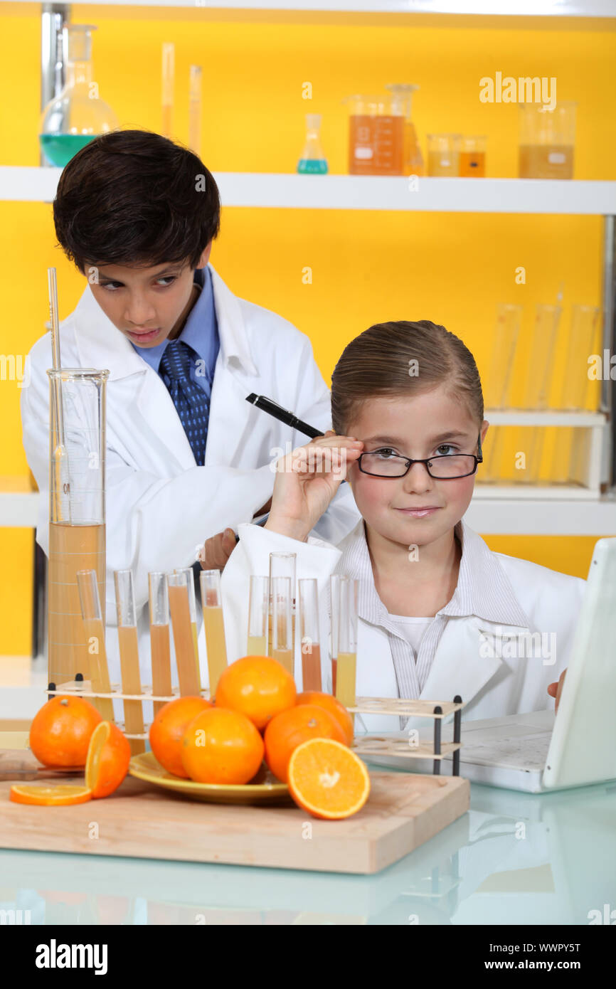 Two kids in science laboratory Stock Photo - Alamy