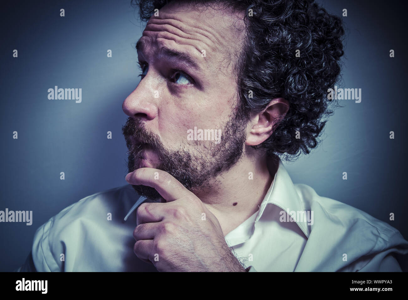 Fear, man with intense expression, white shirt Stock Photo - Alamy