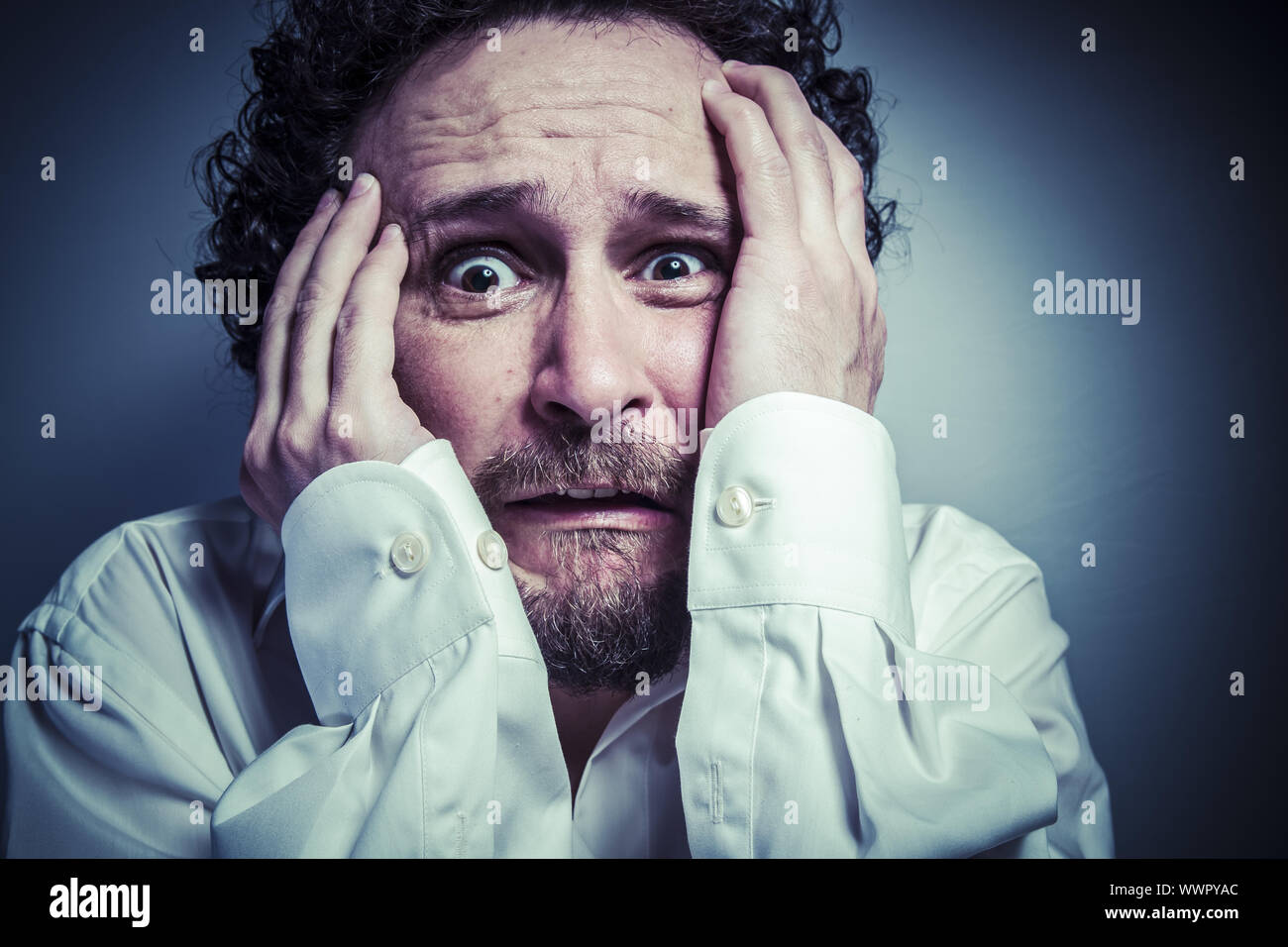 concern for the future, man with intense expression, white shirt Stock ...