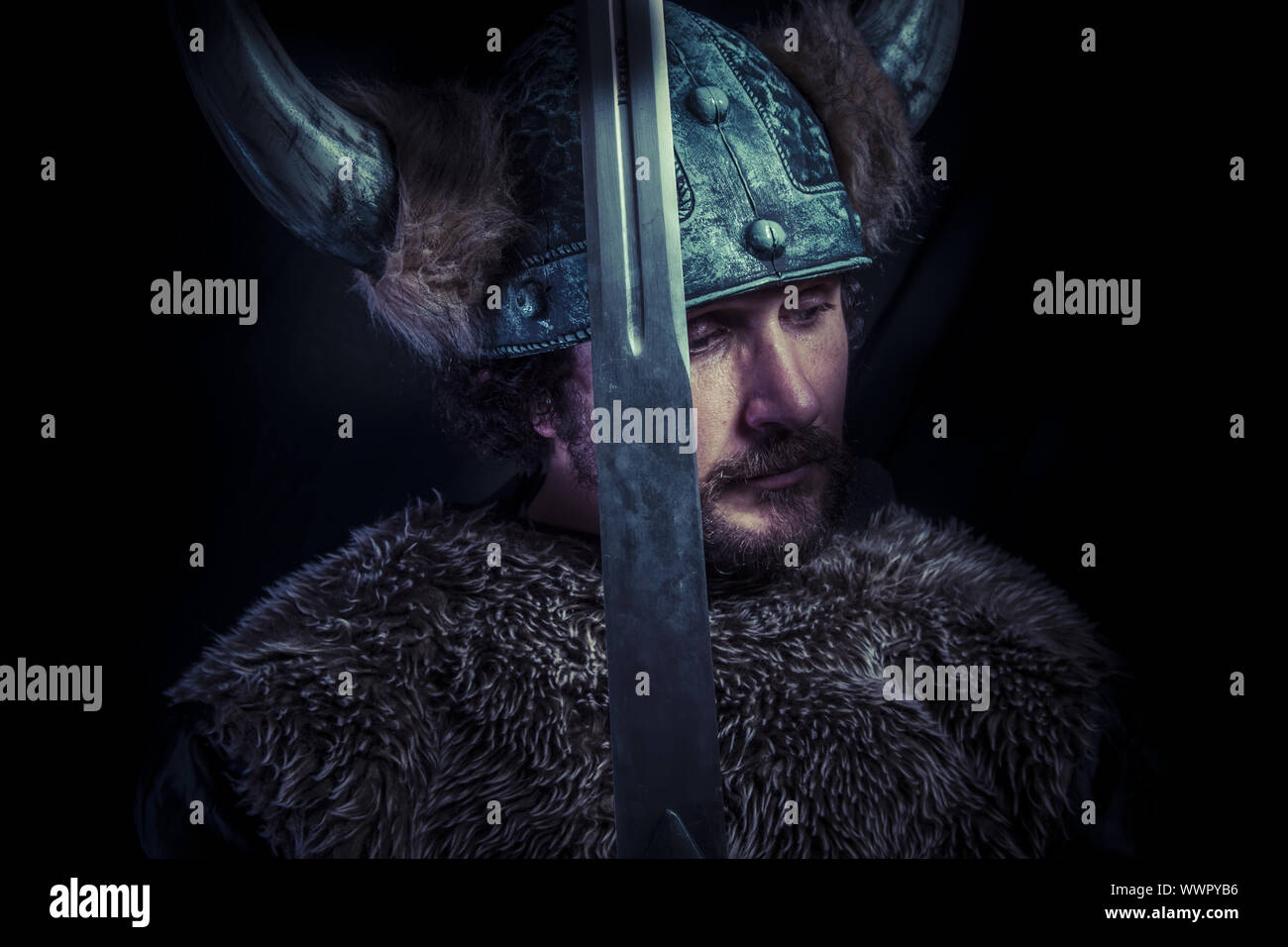 Costume, Viking warrior with a huge sword and helmet with horns Stock ...