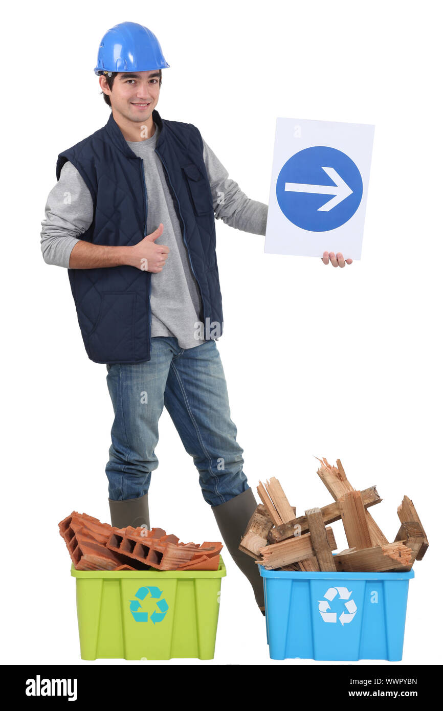 Builder recycling materials Stock Photo - Alamy