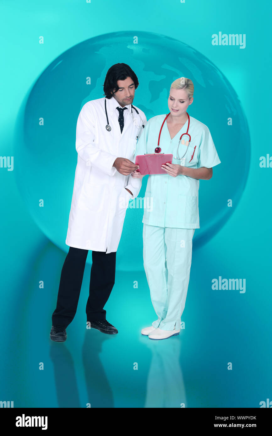 Medical professionals in front of blue background Stock Photo - Alamy