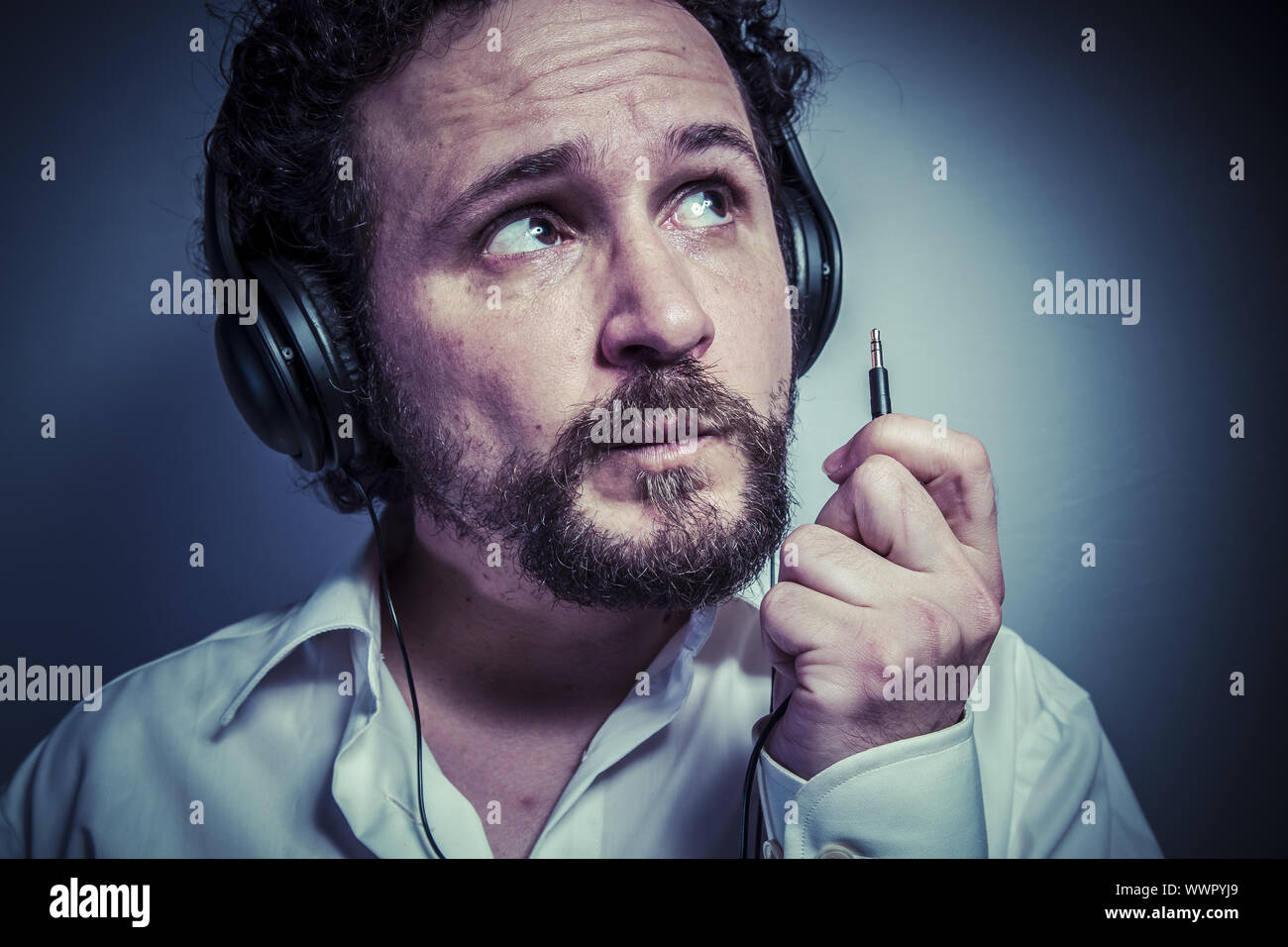 Funny, man with intense expression, white shirt Stock Photo - Alamy