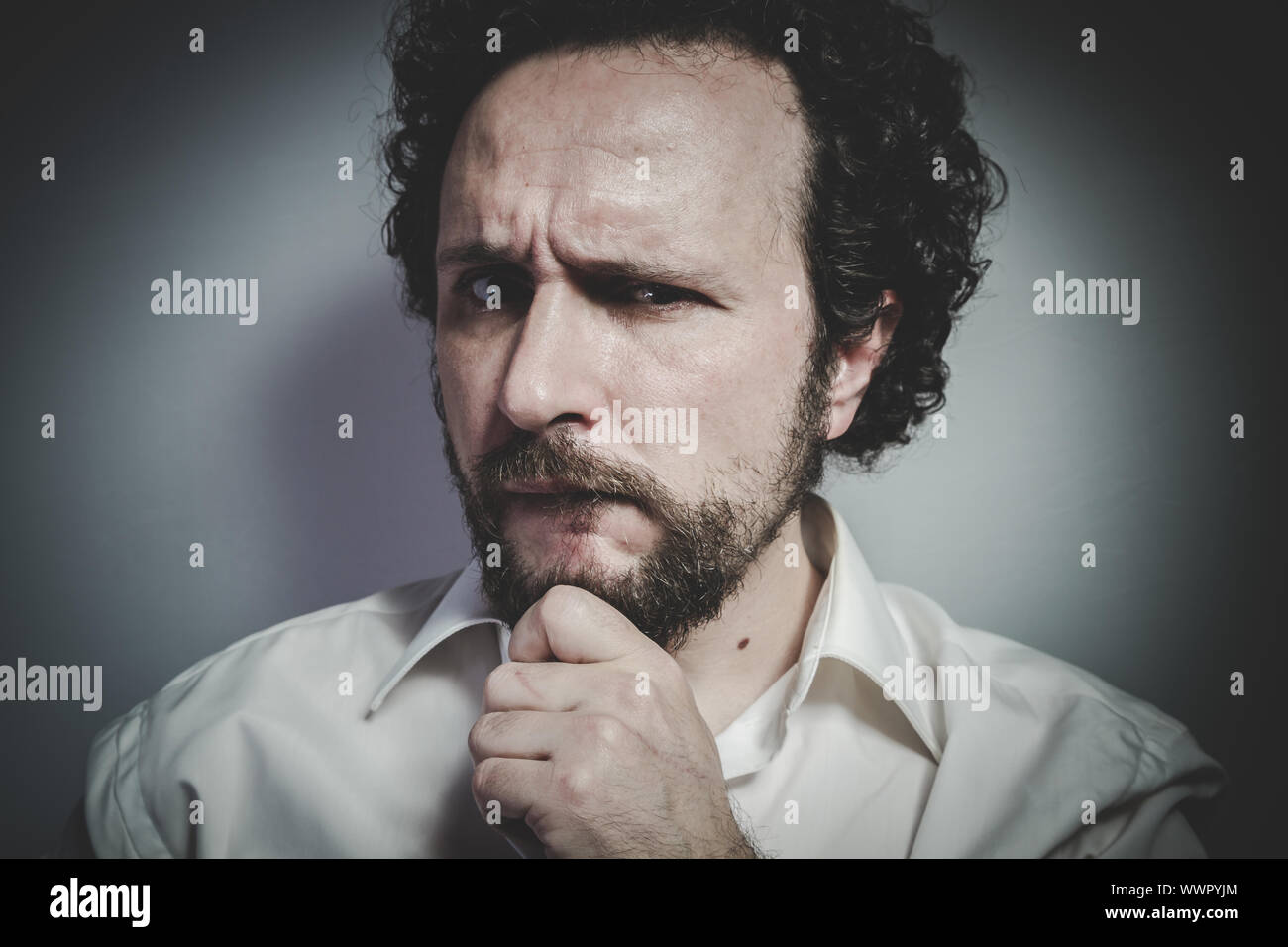 concern for the future, man with intense expression, white shirt Stock ...