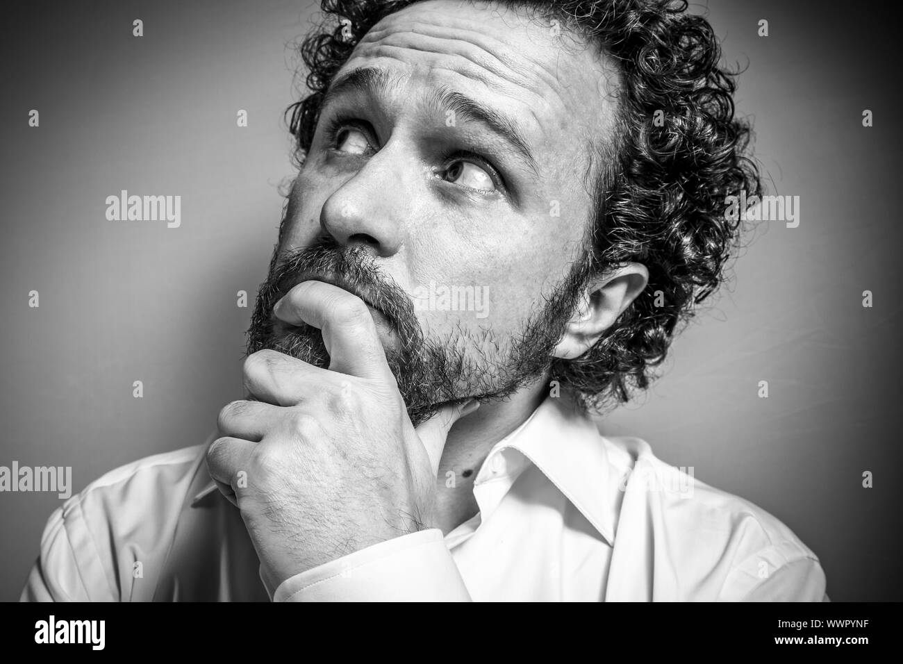 concern for the future, man with intense expression, white shirt Stock ...