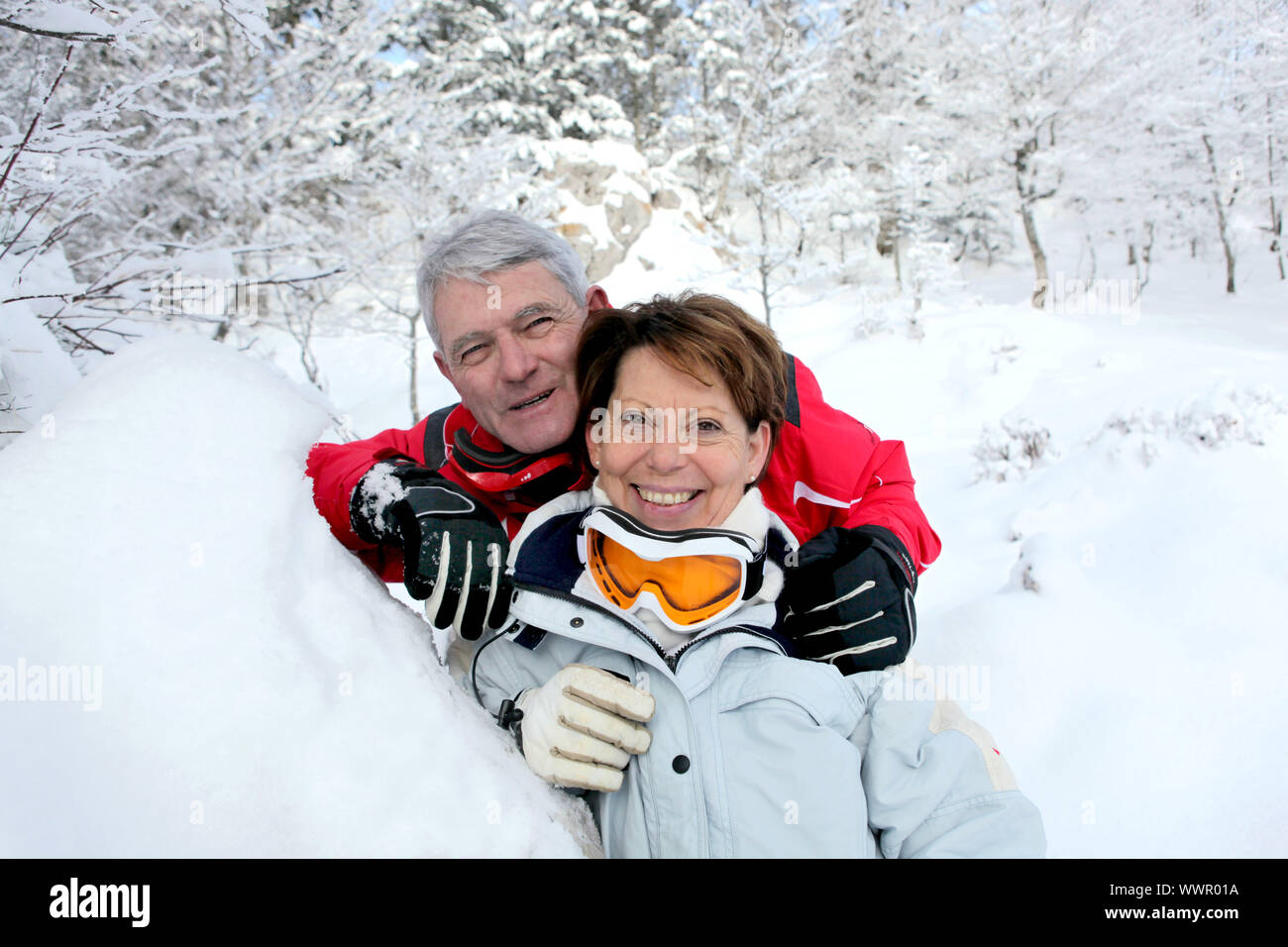 Portrait of happy senior couple in winter landscape hi-res stock ...