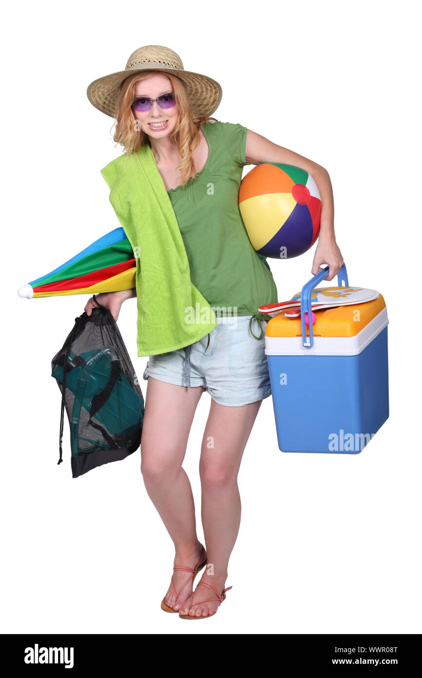 Girl carrying things to the beach Stock Photo - Alamy