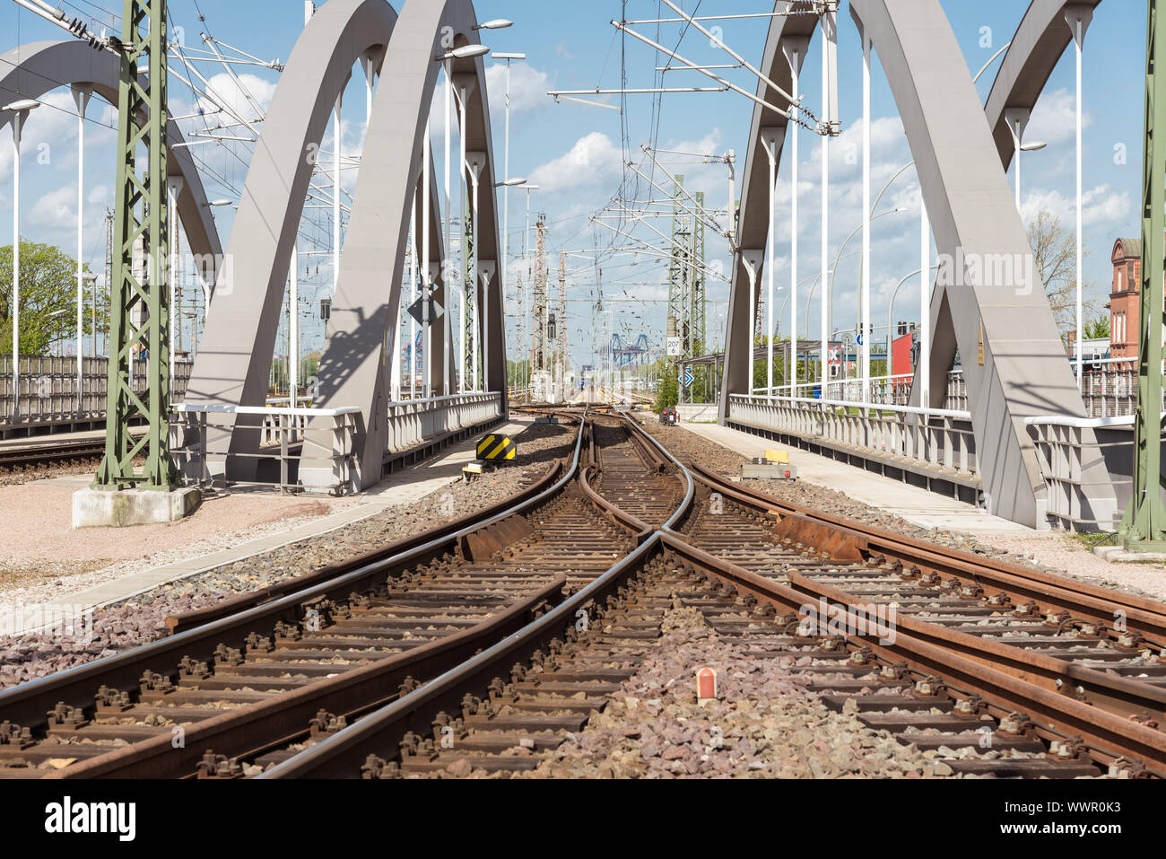 Rail track over a railroad bridge in the harbor of Hamburg Stock Photo ...