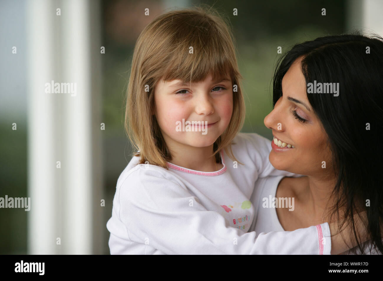 Mother and daughter at home Stock Photo - Alamy