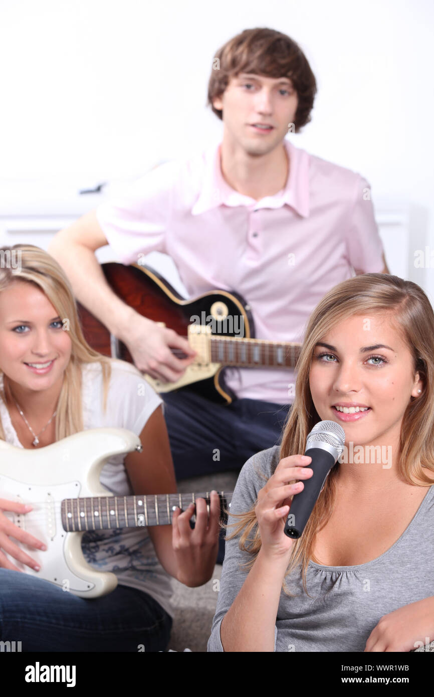 teenagers playing music instruments Stock Photo - Alamy