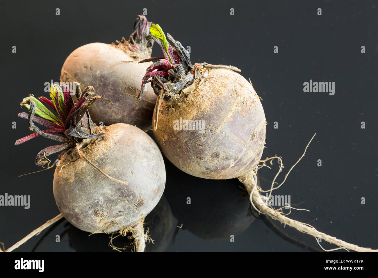Three farm fresh raw beetroot Stock Photo - Alamy