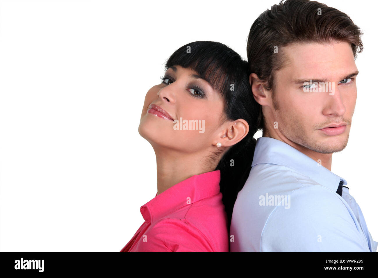 duo standing back to back Stock Photo - Alamy