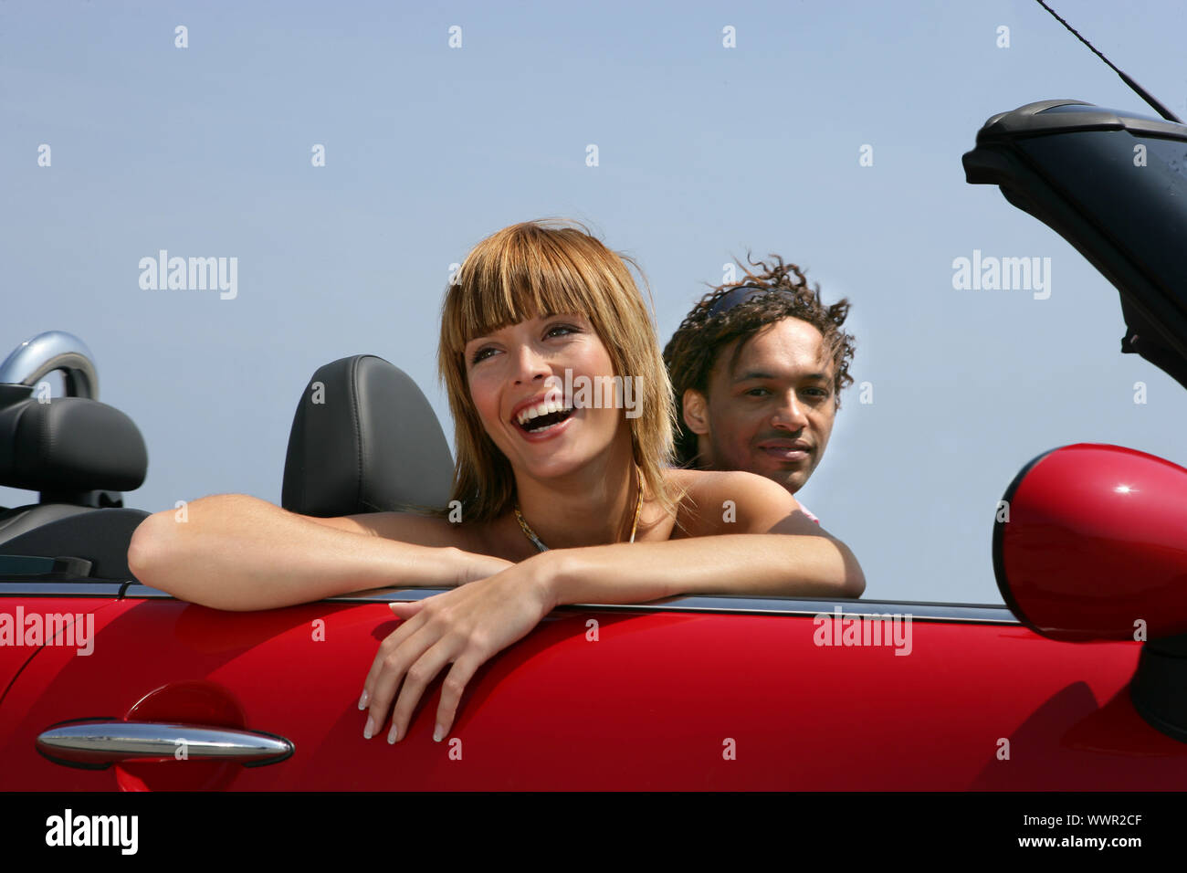Woman riding in a convertible Stock Photo - Alamy