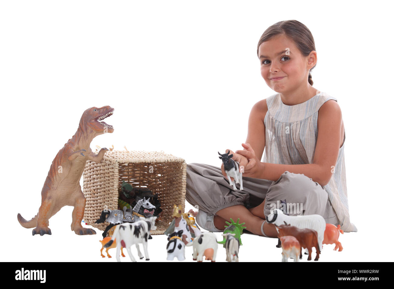 little girl with animal figurines Stock Photo - Alamy