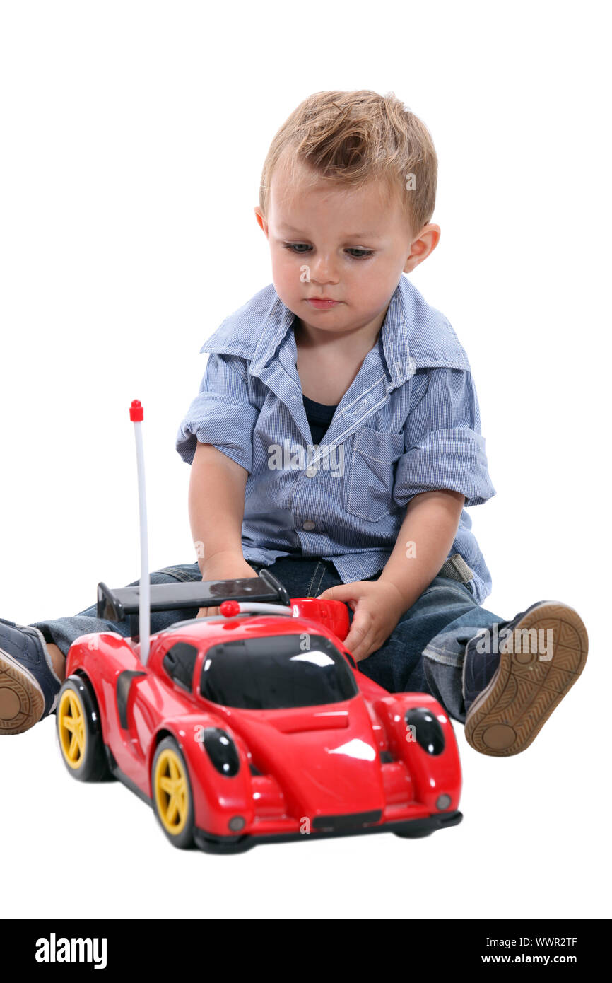 Little boy with a remote controlled car Stock Photo - Alamy