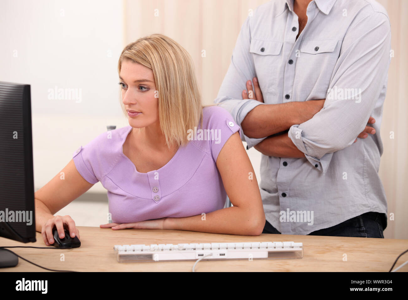 Secretary being watched by her boss Stock Photo - Alamy
