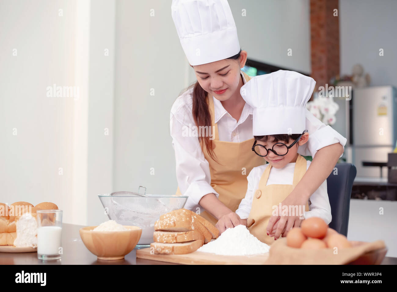 Asian mom teaching her son to cook hi-res stock photography and images ...