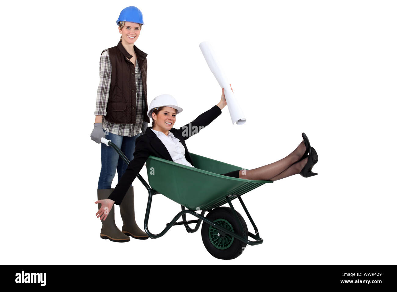 Woman pushing another woman in wheelbarrow Stock Photo - Alamy