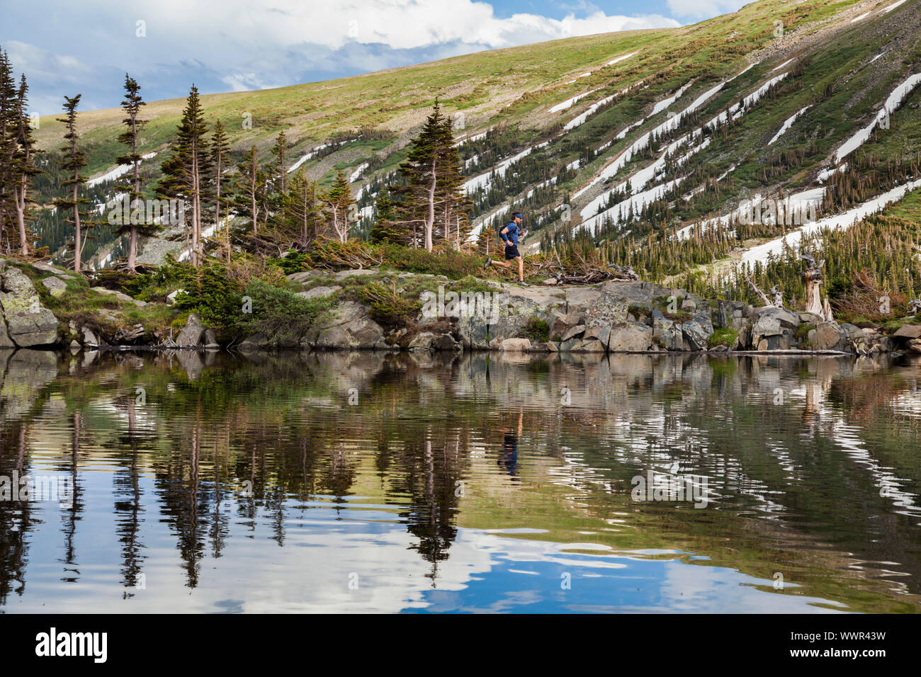 Man running along shore lake hi-res stock photography and images - Alamy