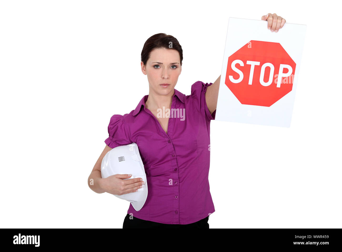a construction manager showing a stop panel Stock Photo - Alamy