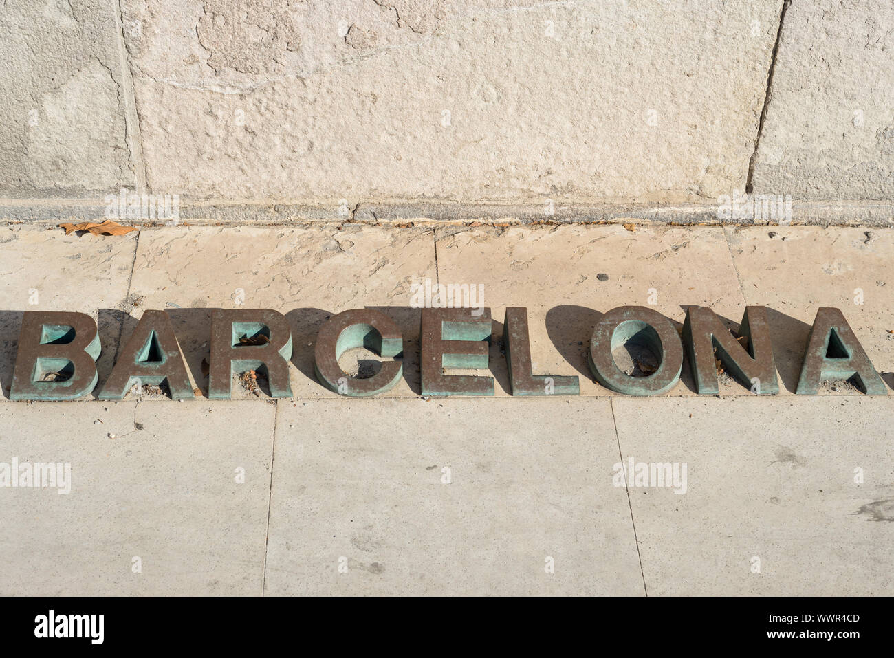 Barcelona lettering from metal on the ground at the Plaça de Antonio ...