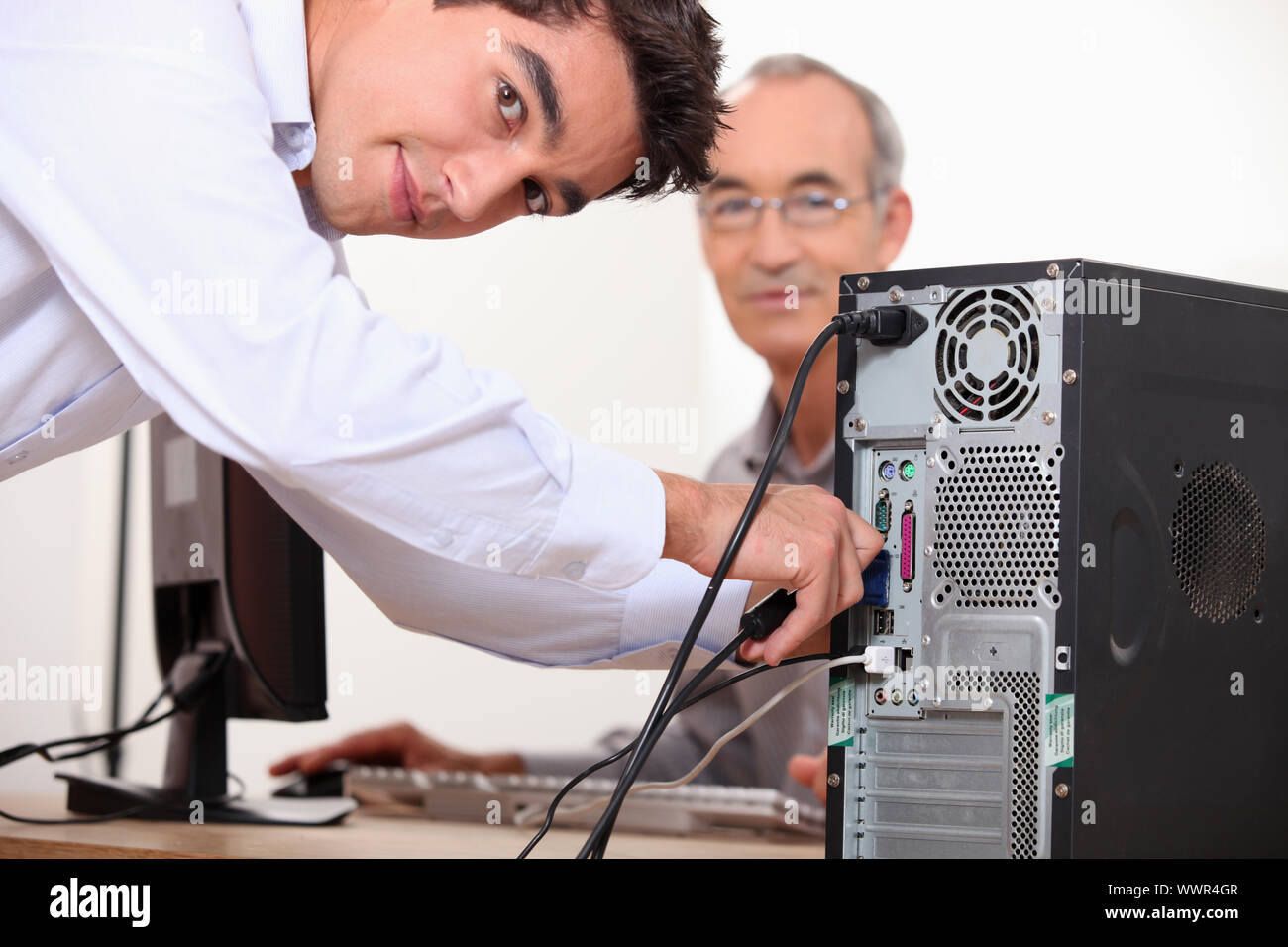 Computer technician repairing PC Stock Photo - Alamy