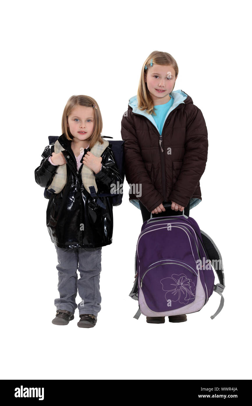 Two girls with schoolbags Stock Photo - Alamy