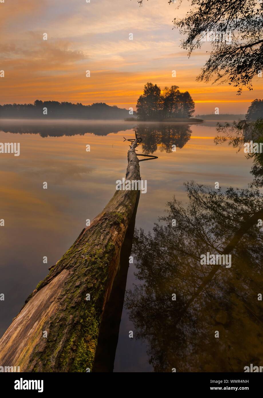 Beautiful lake sunrise with sky reflections in water. Tranquil colorful ...