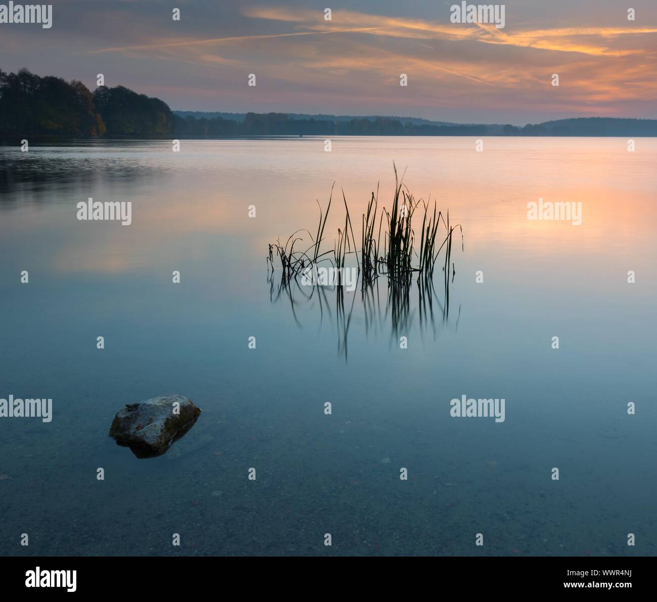 Beautiful lake sunrise with sky reflections in water. Tranquil colorful ...