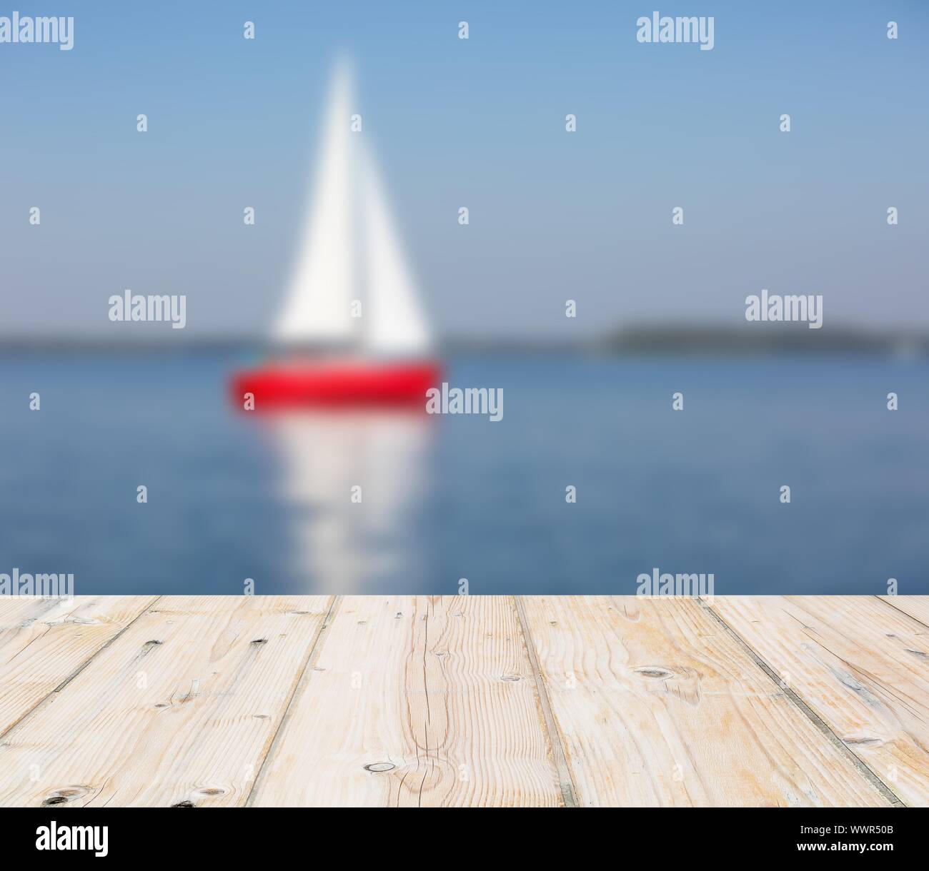 blurry lake abstraction with wooden planks floor and yacht Stock Photo ...