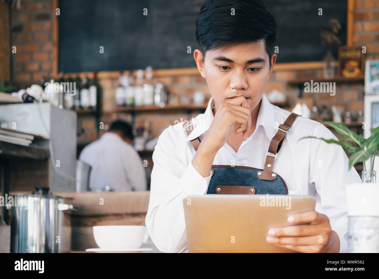 Small business owner of a cafe. Young startup owner small cafe shop ...