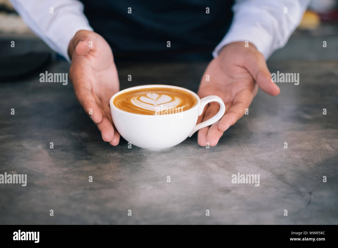 Young owner of coffee cafe service customer. Small business and owner ...