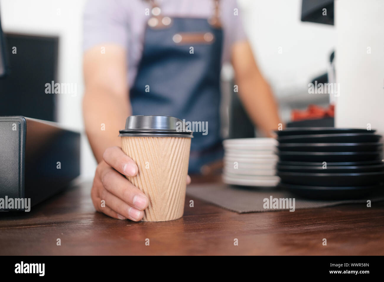 Young owner of coffee cafe service customer. Small business and owner ...
