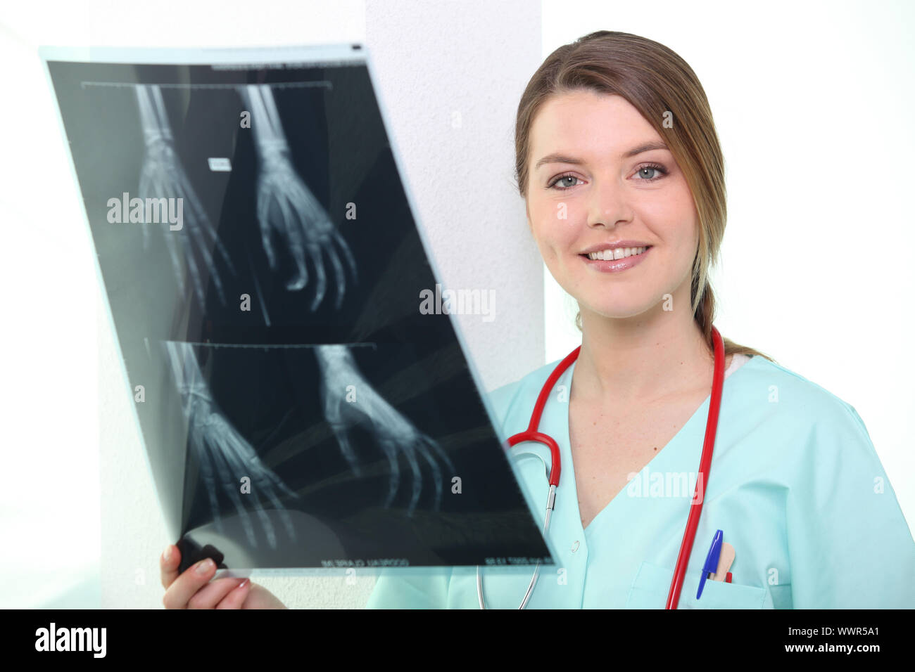 Nurse smiling with X-ray Stock Photo - Alamy