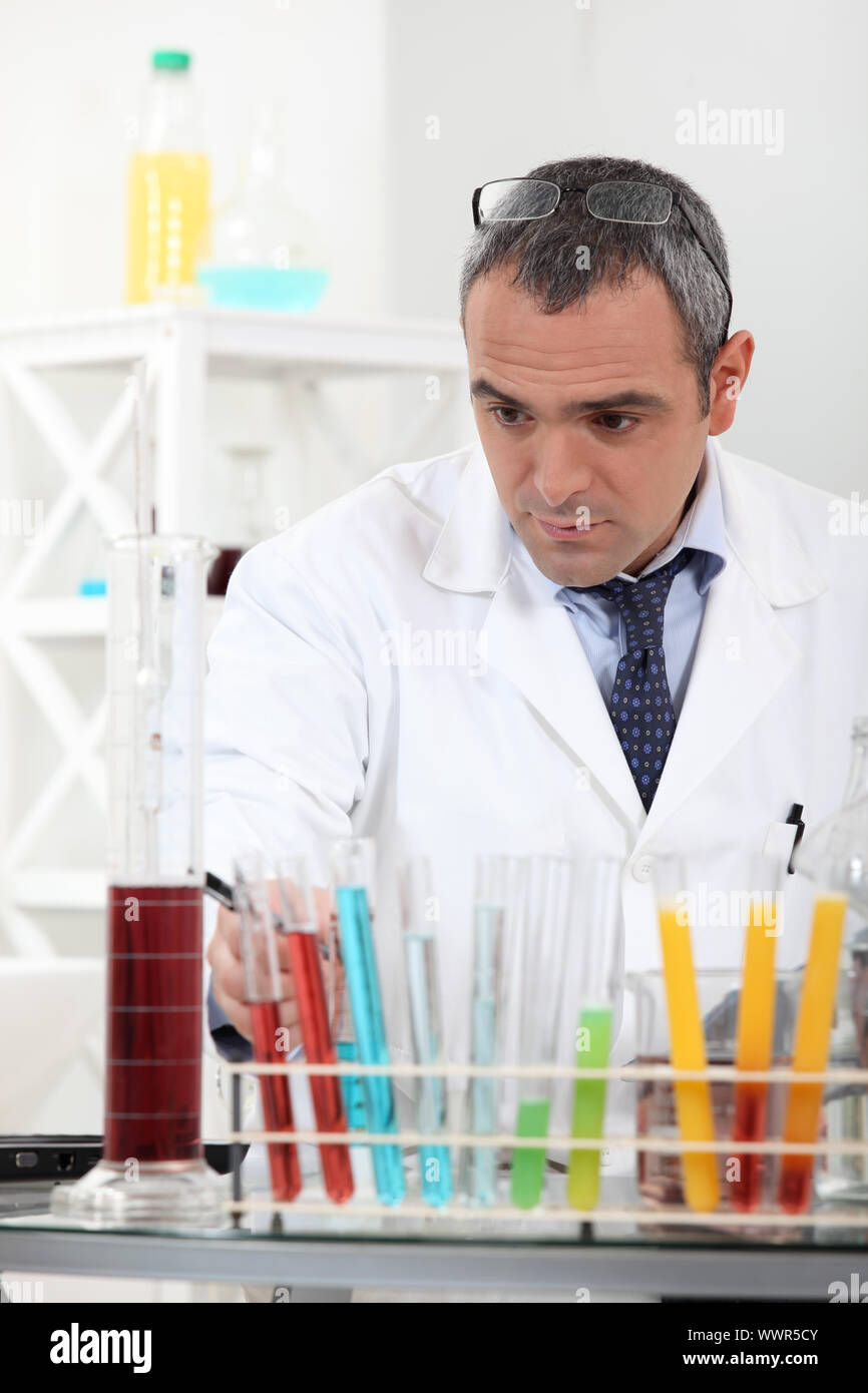Man conducting an experiment Stock Photo - Alamy