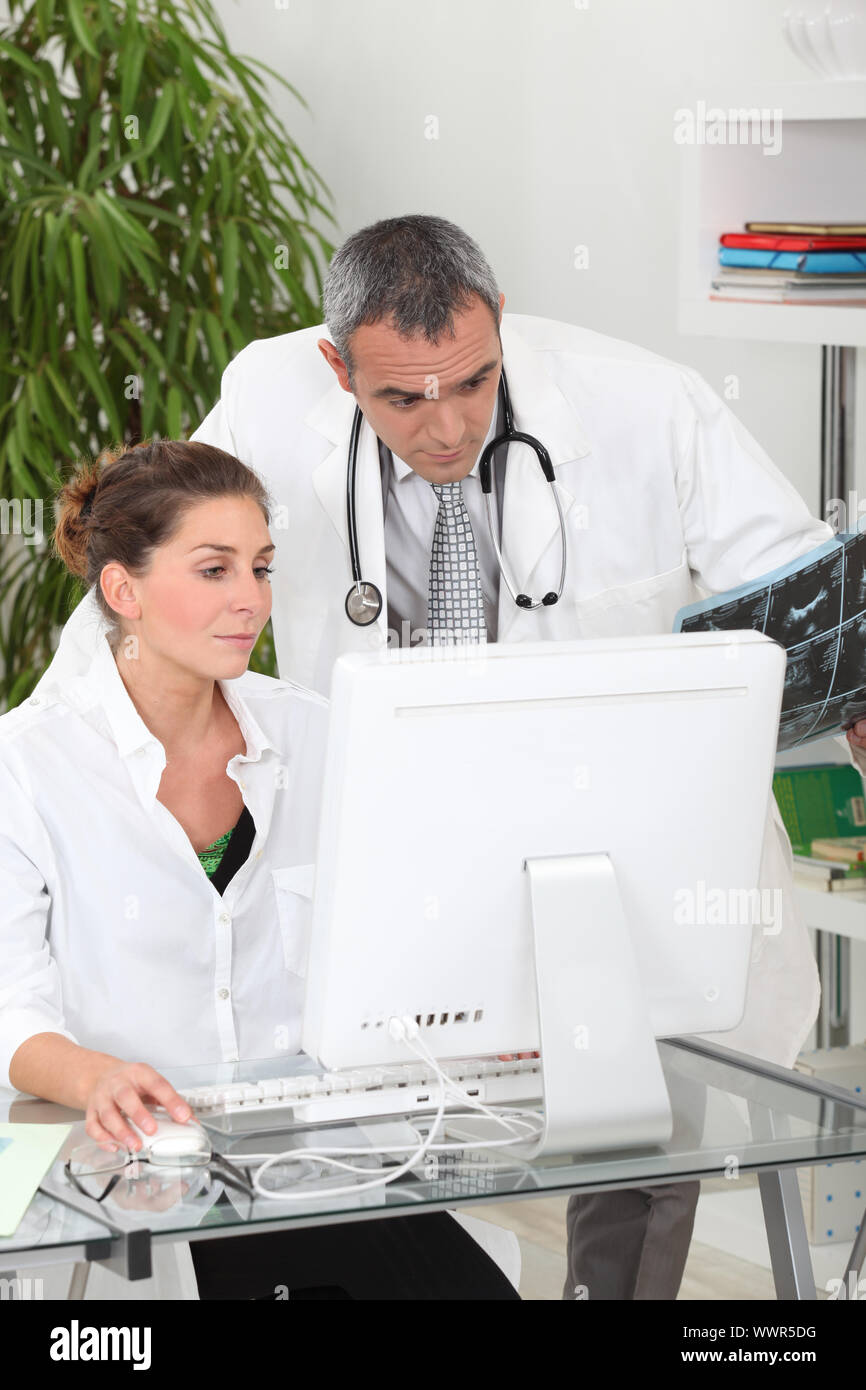 doctor and nurse discussing a case Stock Photo - Alamy