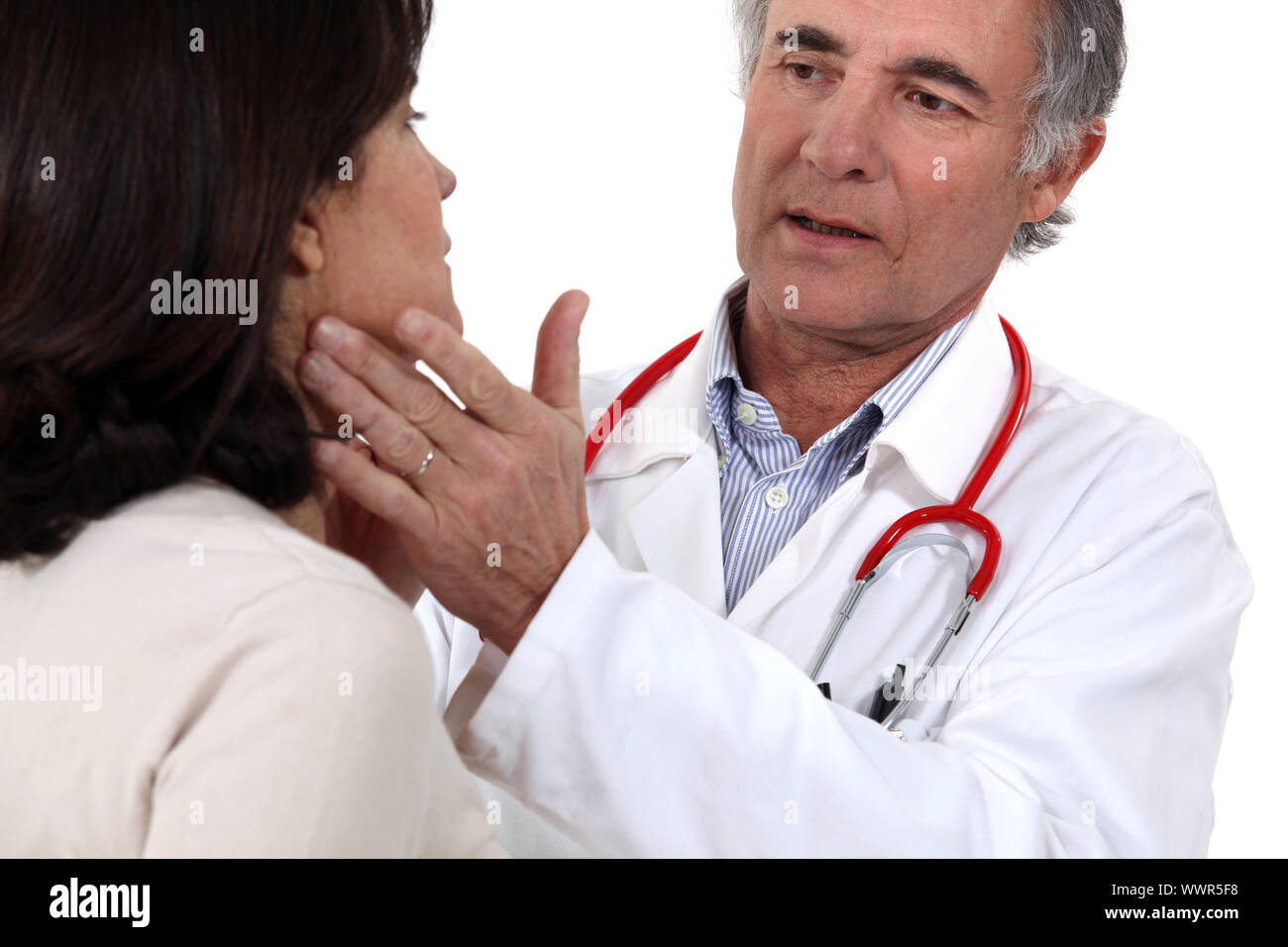 Woman being treated by doctor Stock Photo - Alamy