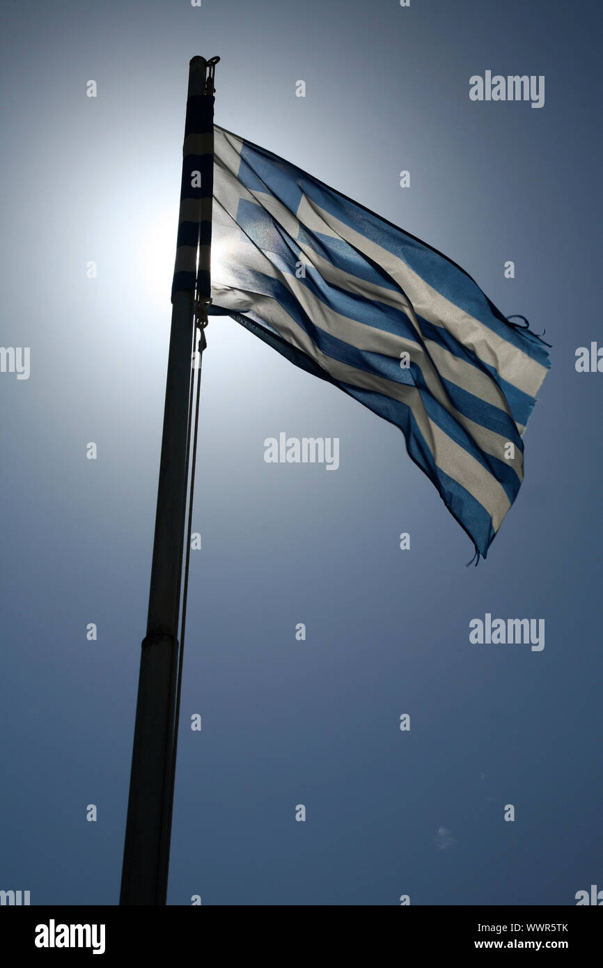 greek flag flying against the sun in crete Stock Photo - Alamy